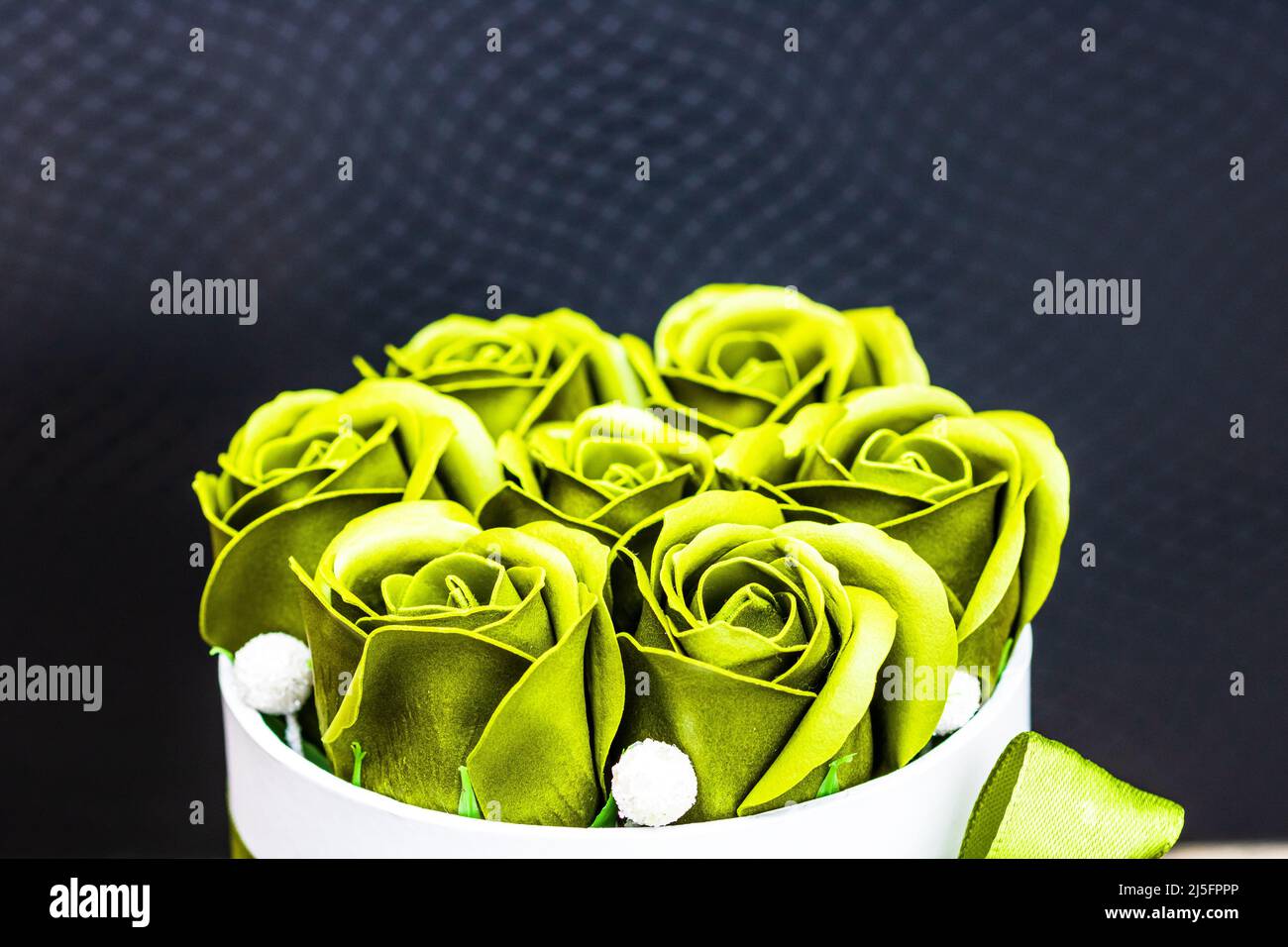 Green roses in a round luxury present box. Bouquet of flowers in a ...