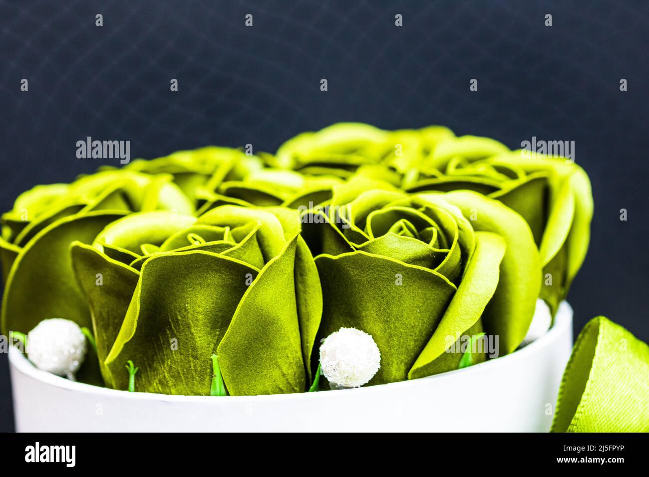 Green roses in a round luxury present box. Bouquet of flowers in a ...