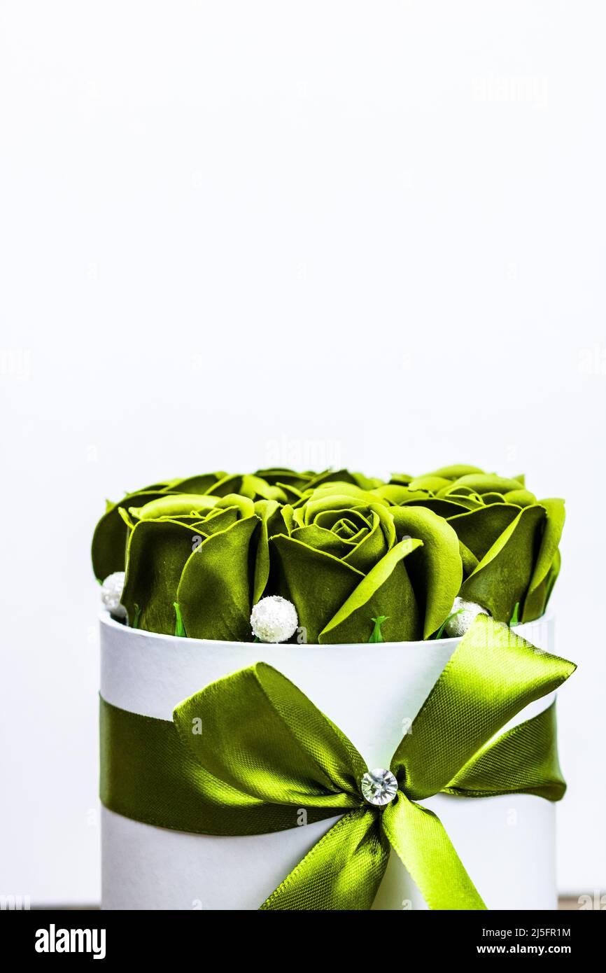 Green roses in a round luxury present box. Bouquet of flowers in a ...