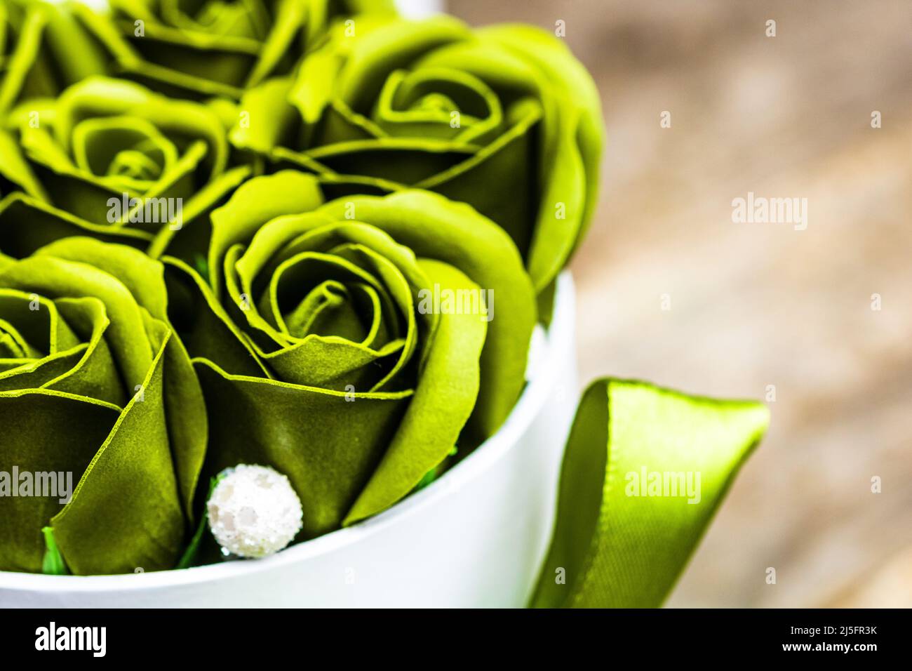 Green roses in a round luxury present box. Bouquet of flowers in a ...
