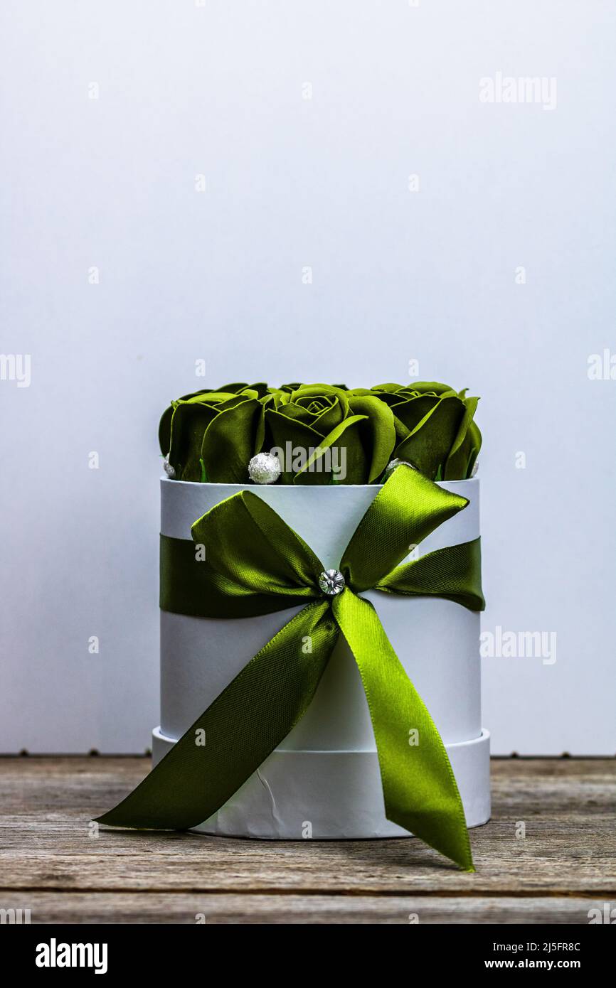 Green roses in a round luxury present box. Bouquet of flowers in a ...