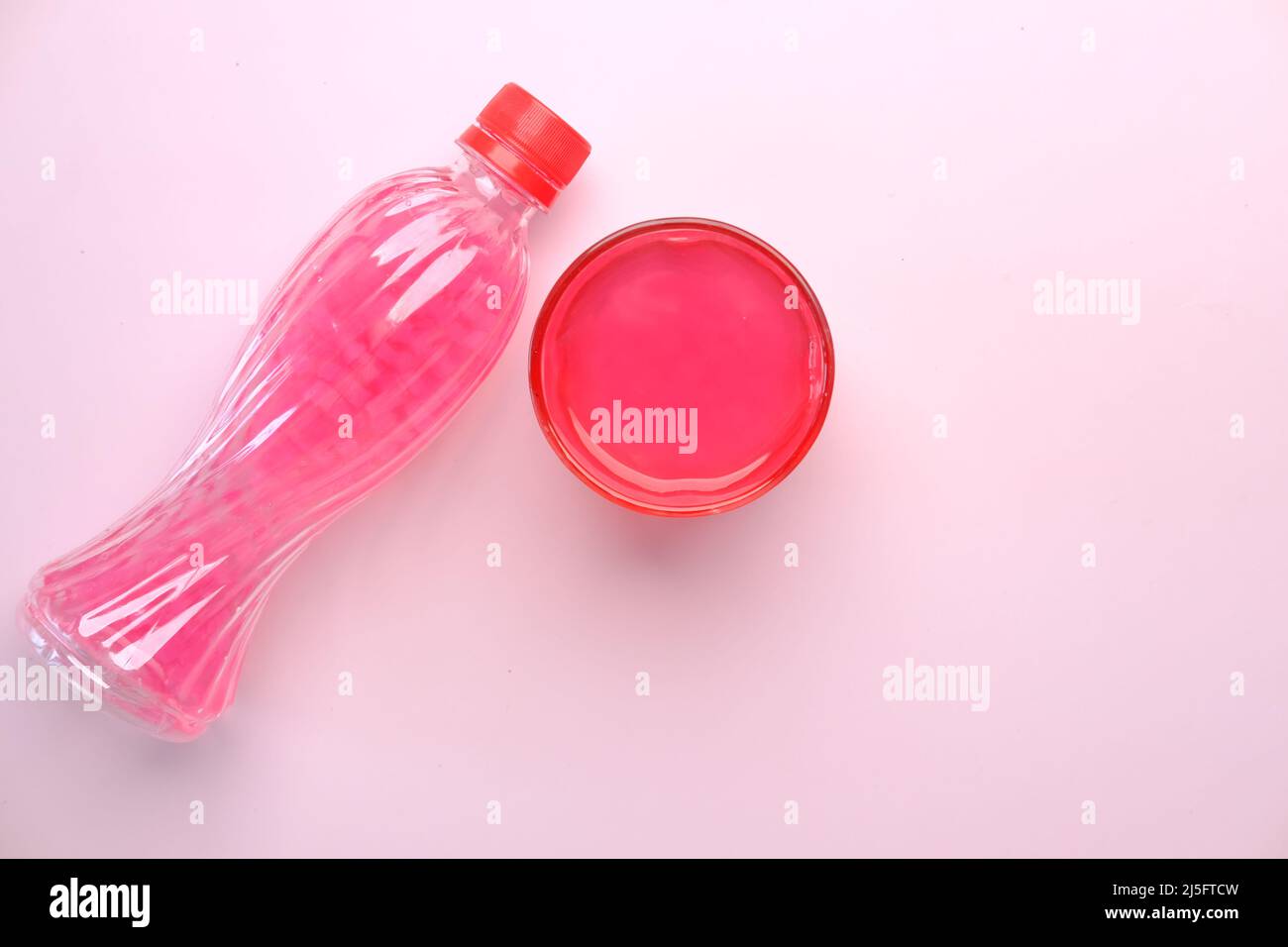pink color soft drink bottle on table Stock Photo - Alamy