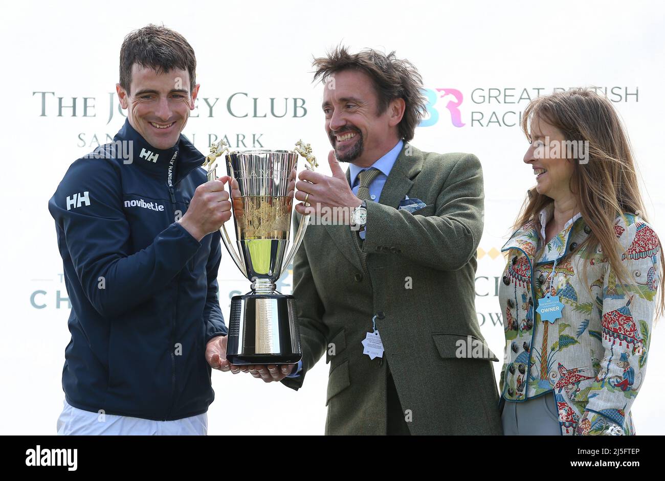 Champion jockey Brian Hughes receives the trophy from Richard Hammond ...