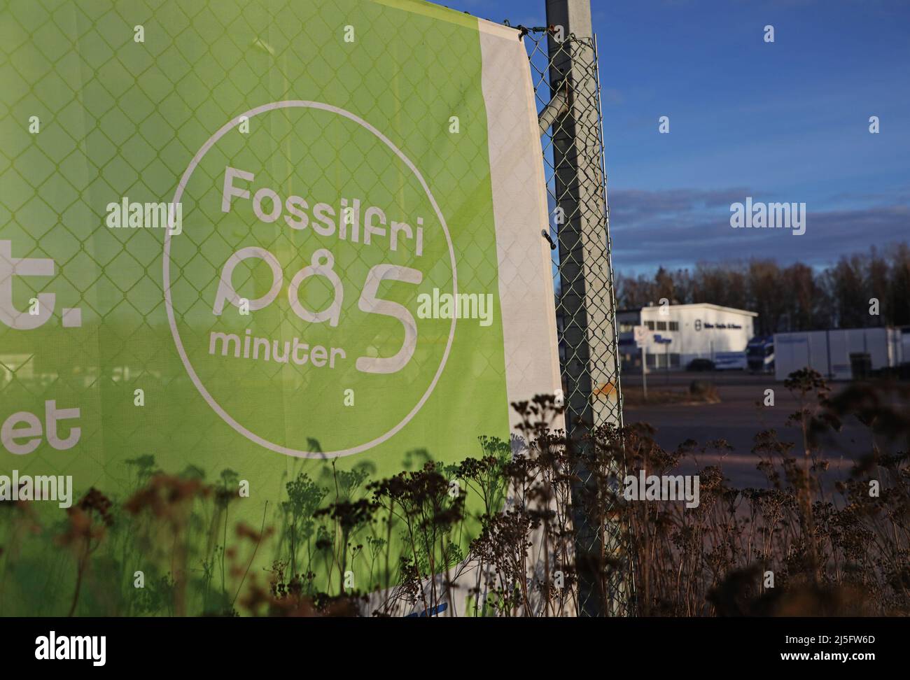 Signs at a fuel station with the text "Fossilfri på 5 minuter" (In ...
