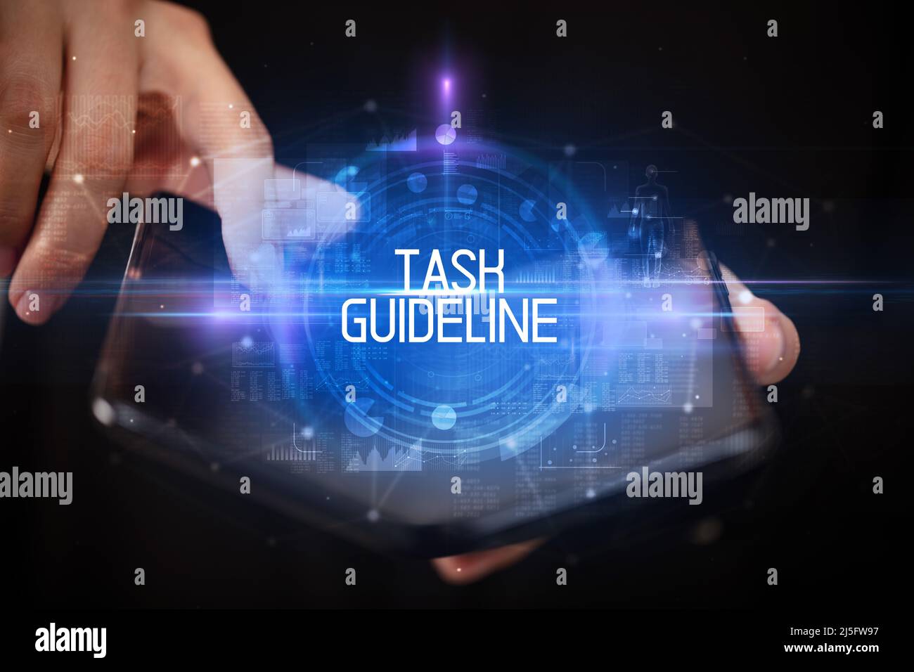 Young man holding a foldable smartphone Stock Photo - Alamy