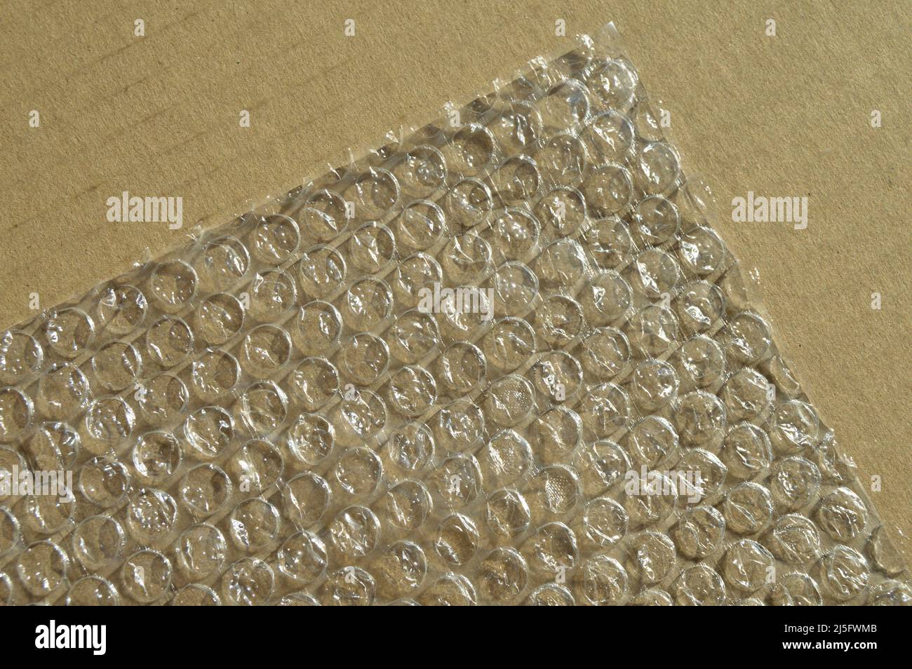 On corrugated cardboard paper plastic air bubble protection foil wrap ...