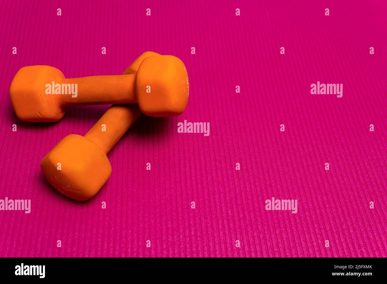 Orange space dumbbell fitness mat gym background copy training, concept ...