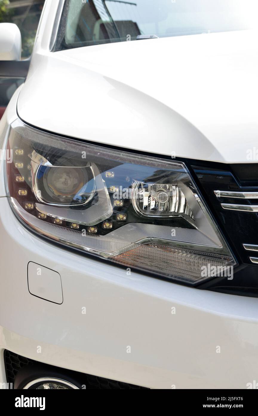 Detail of car headlights lamp, white modern a luxury car front lamp ...