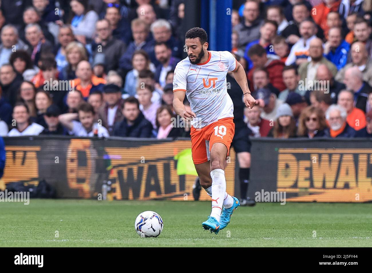 Luton, UK. 23rd Apr, 2022. Keshi Anderson #10 of Blackpool breaks with ...