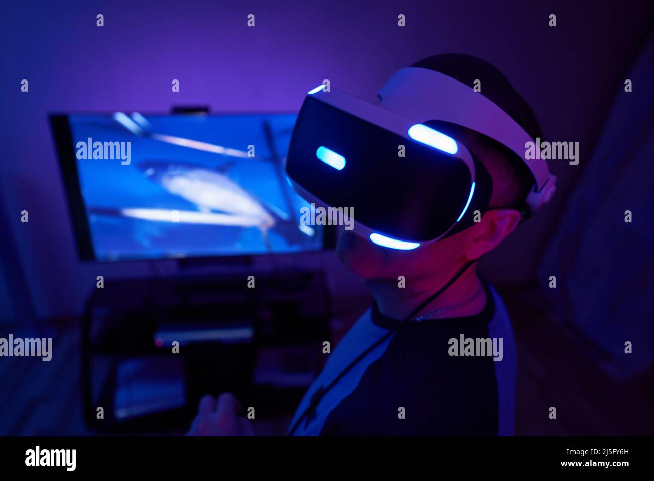 Man is using virtual reality headset for seeing shark and other ...