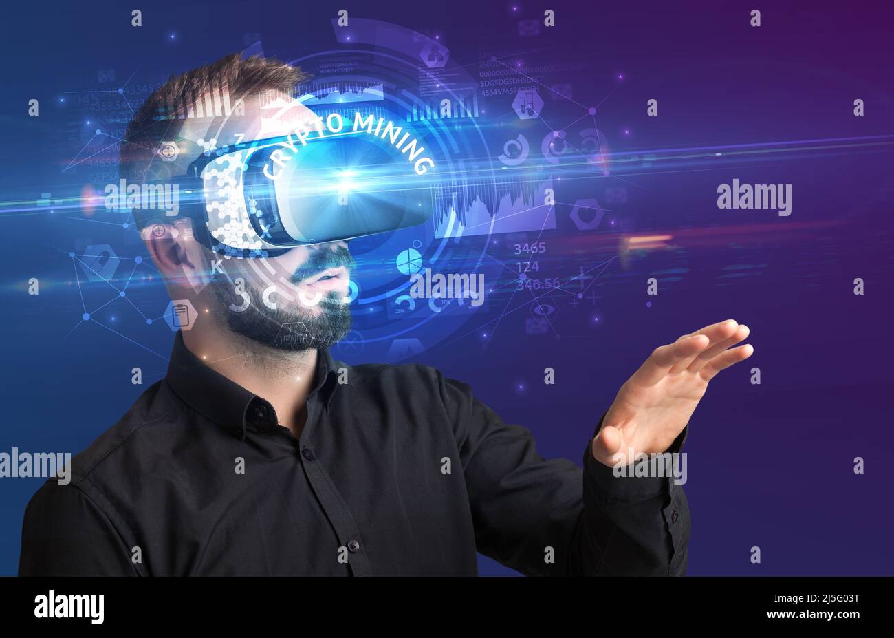 Businessman looking through VR glasses Stock Photo - Alamy