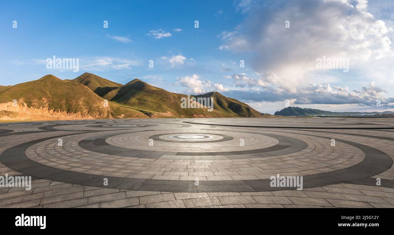 Empty square floor and mountain nature scenery. Road and mountains ...