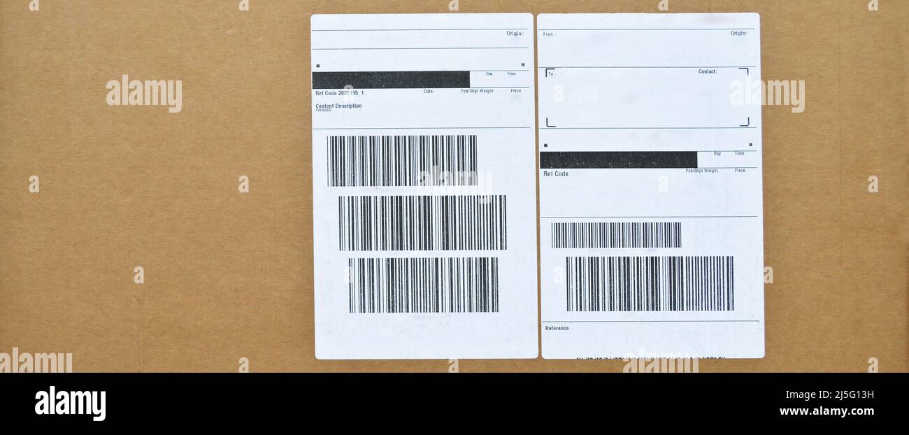 Brown and beige cardboard paper mail envelope on sticky barcodes. Can ...
