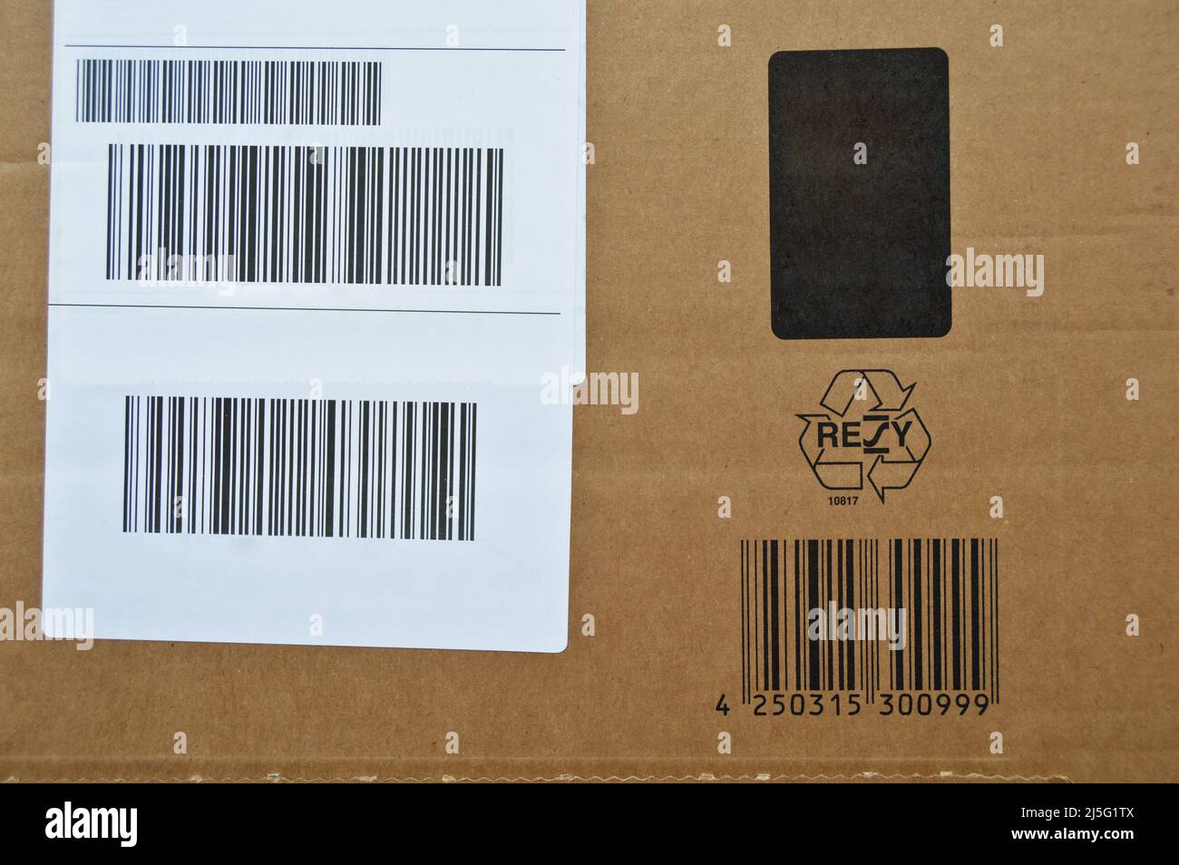 Brown and beige cardboard paper mail envelope on sticky barcodes. Can ...