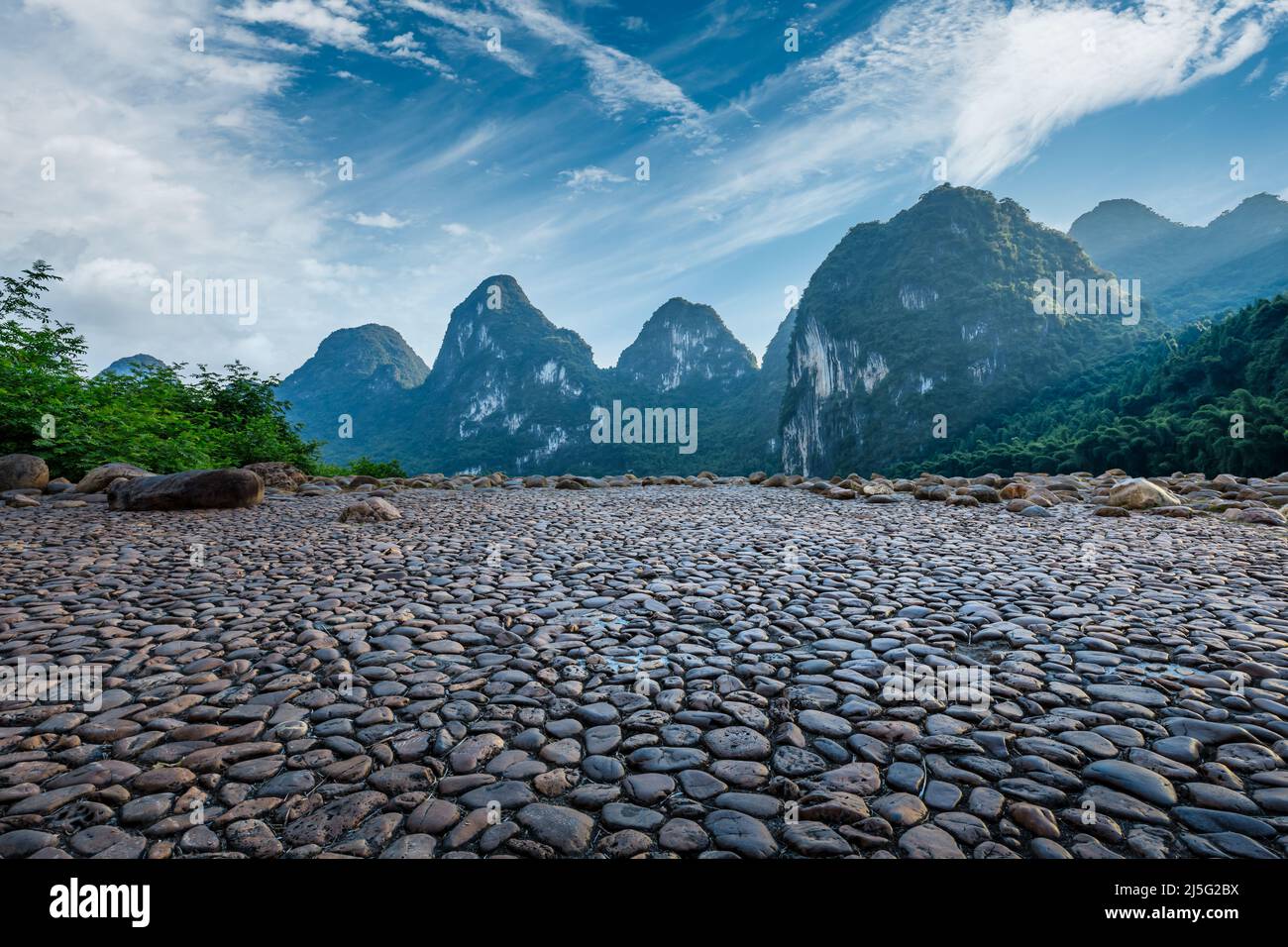 Cobblestone square and beautiful mountain nature scenery in summer ...