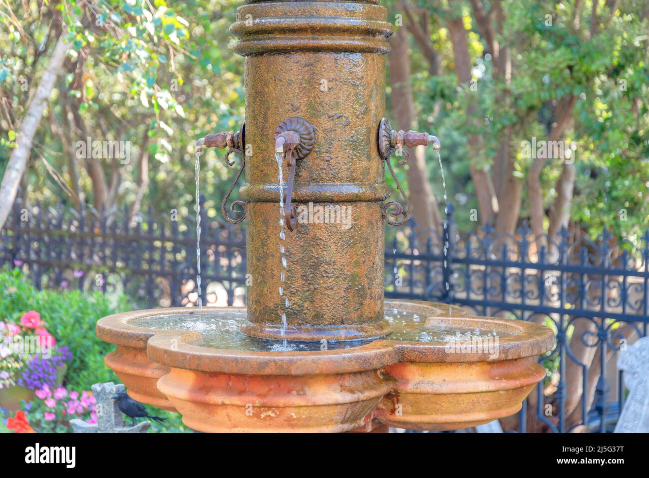 Antique bronze water fountain at San Francisco in California. Water ...