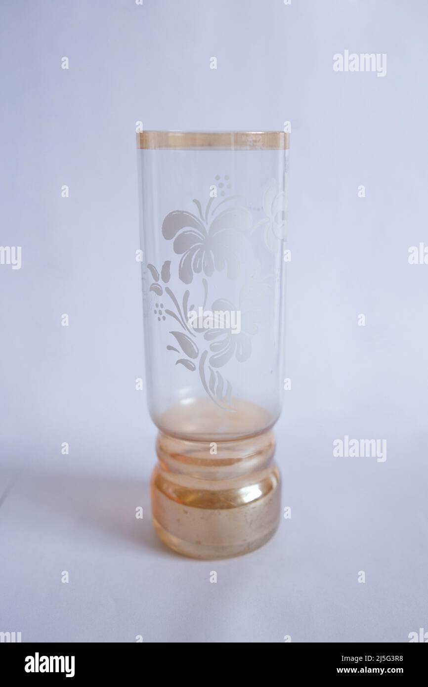 a glass transparent glass empty with a pattern on a white background ...