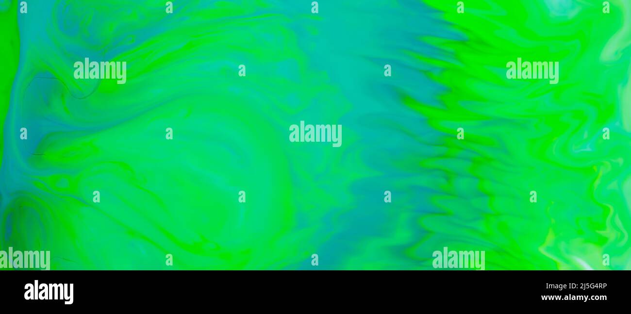 Fluid art background in green color. Green-turquoise stains on liquid ...