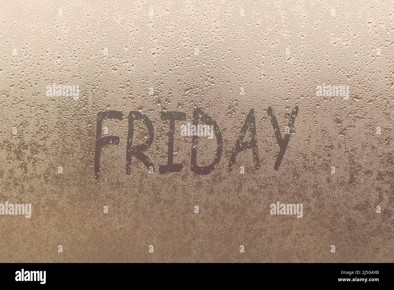 friday written on the glass screen with raindrops background Stock ...
