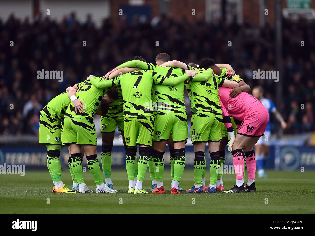 Forest Green Rovers players have a team huddle during the Sky Bet ...