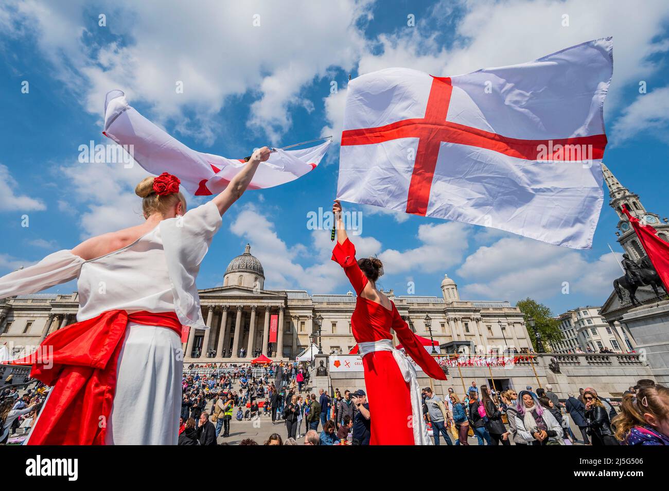 London, UK. 23rd Apr, 2022. The divine stilt walkers with their George ...