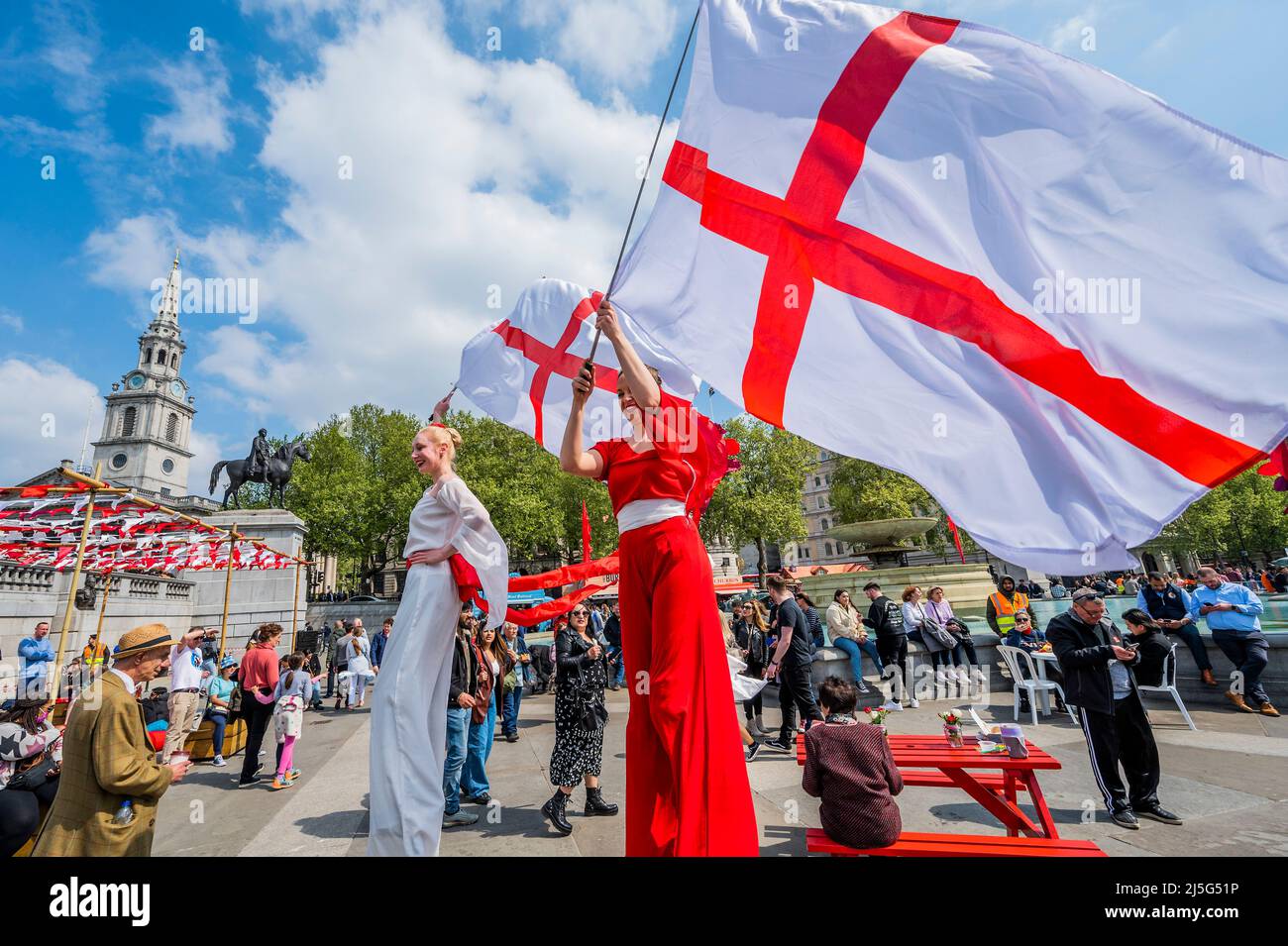 London, UK. 23rd Apr, 2022. The divine stilt walkers with their George ...