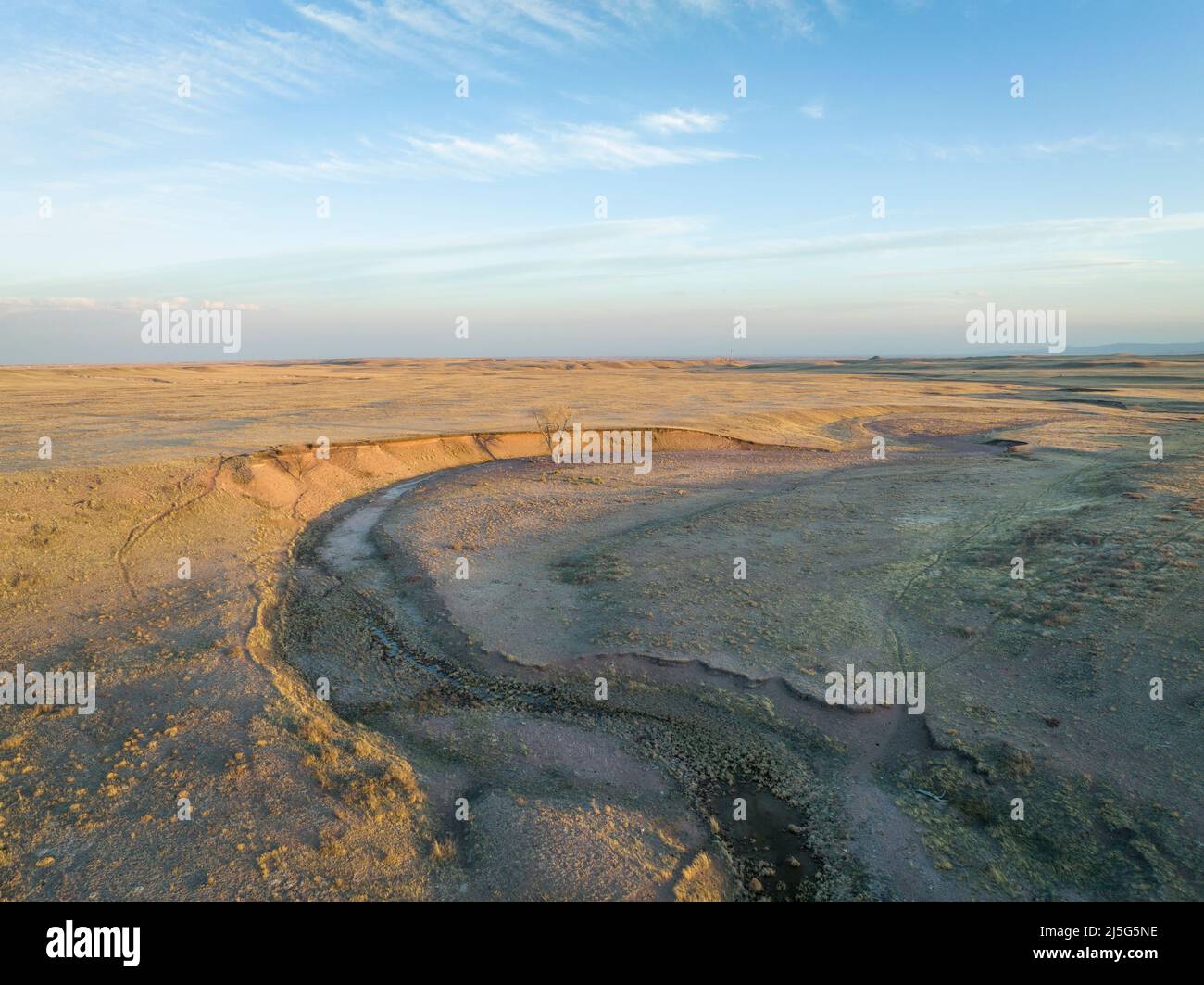 early spring on Colorado prairie - aerial view of grassland with a ...