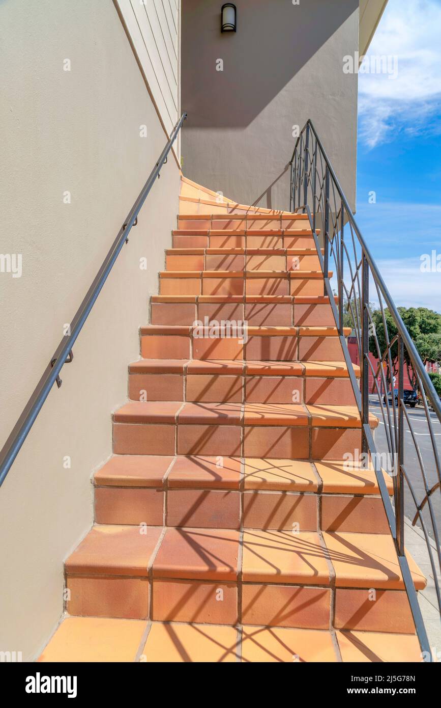 Tiled outdoor staircase of a house with wrought iron railings at San ...