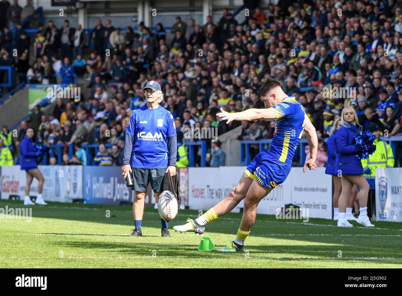 Riley Dean #27 of Warrington Wolves successfully kicks a conversion to ...