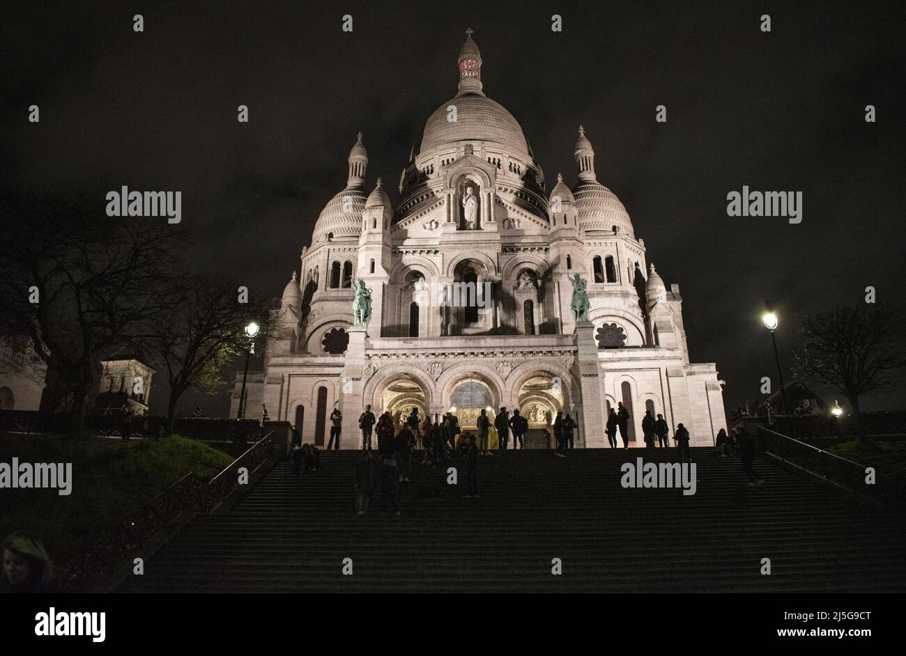 Paris, France: night view of the famous Basilica of the Sacred Heart ...