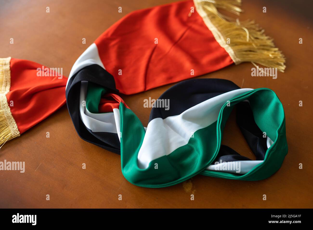 waving fabric texture of the flag with color of united arab emirates ...