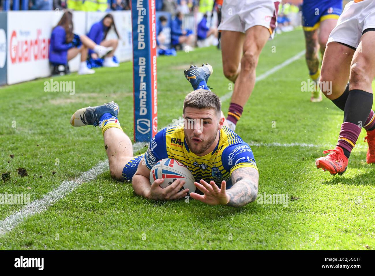 Connor Wrench #23 of Warrington Wolves goes over for a try to make it ...