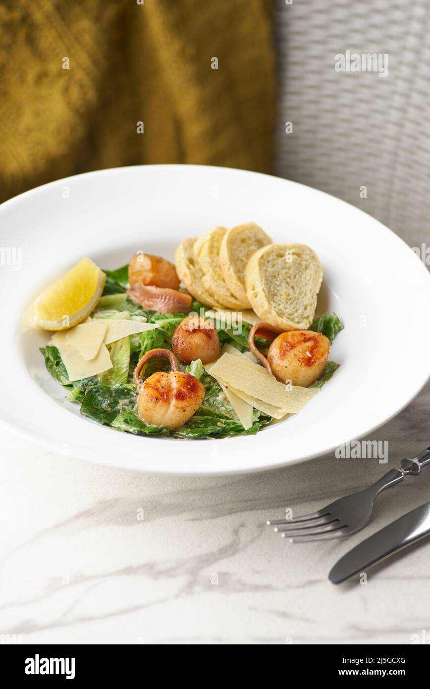 Gourmet dish - sea scallops grilled white plate. Scallops with ...