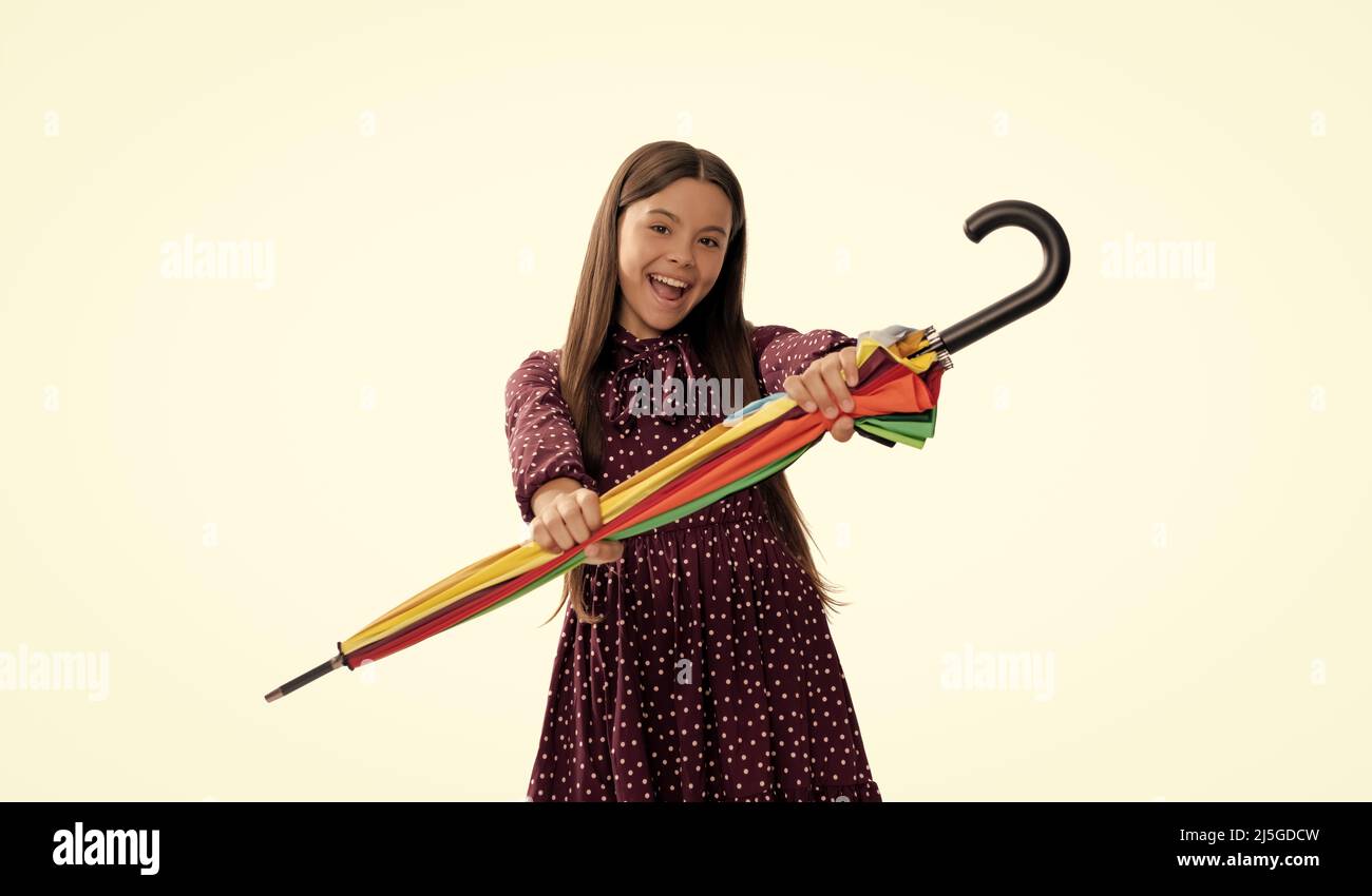 happy child hold colorful parasol. kid with rainbow umbrella isolated ...