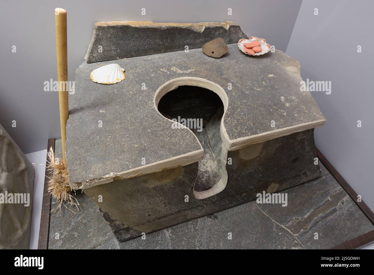 Replica of an ancient toilet Stock Photo - Alamy
