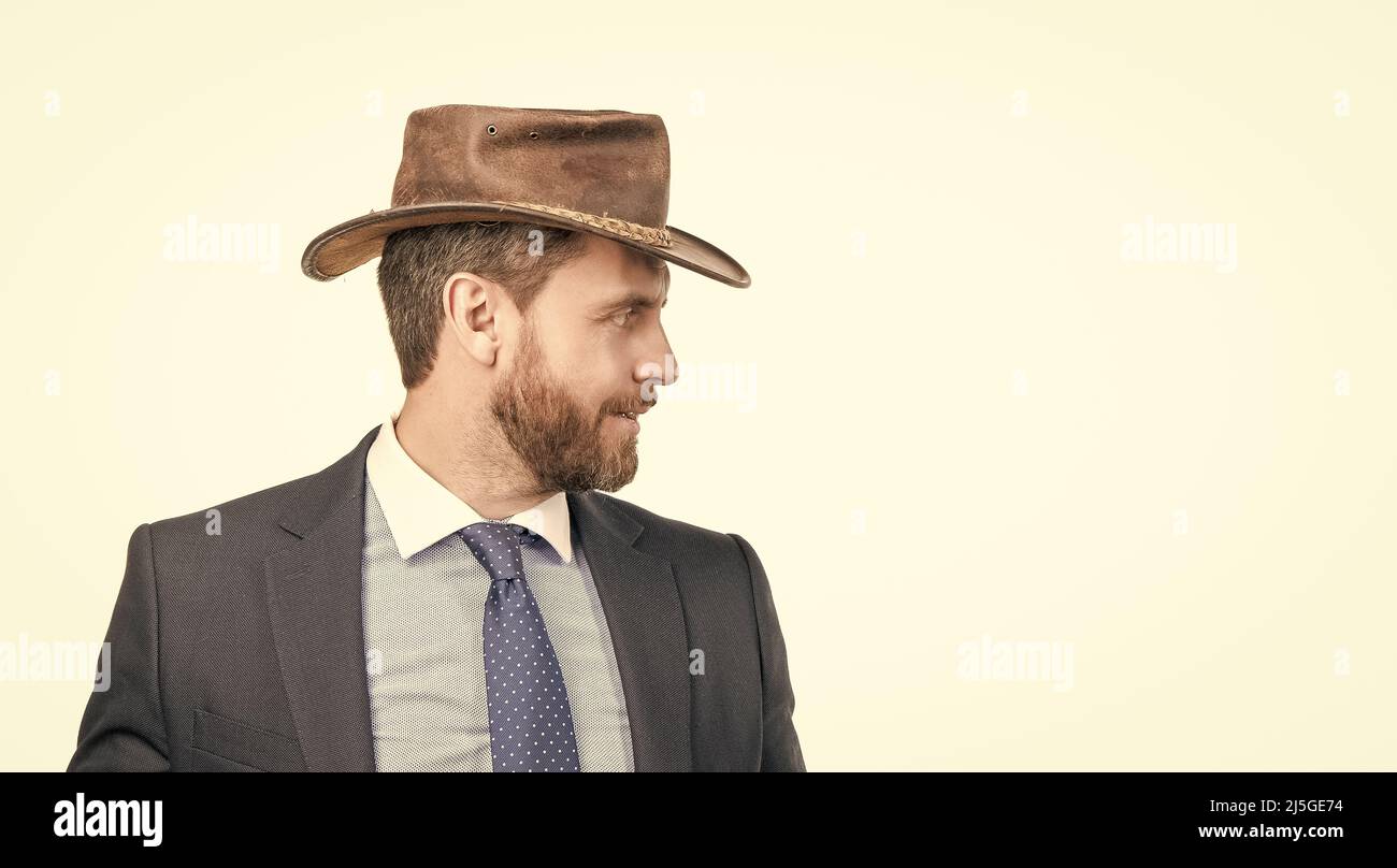 Be unique in yourself. Senior manager side-face. Manager in cowboy hat ...