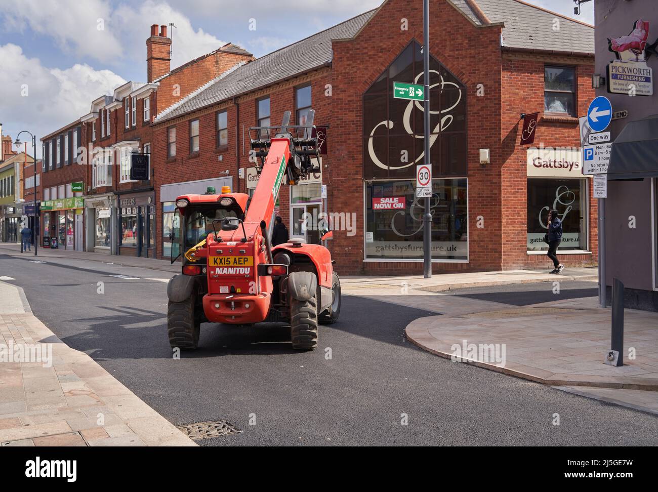 Telehandler construction machine in a town center Stock Photo - Alamy