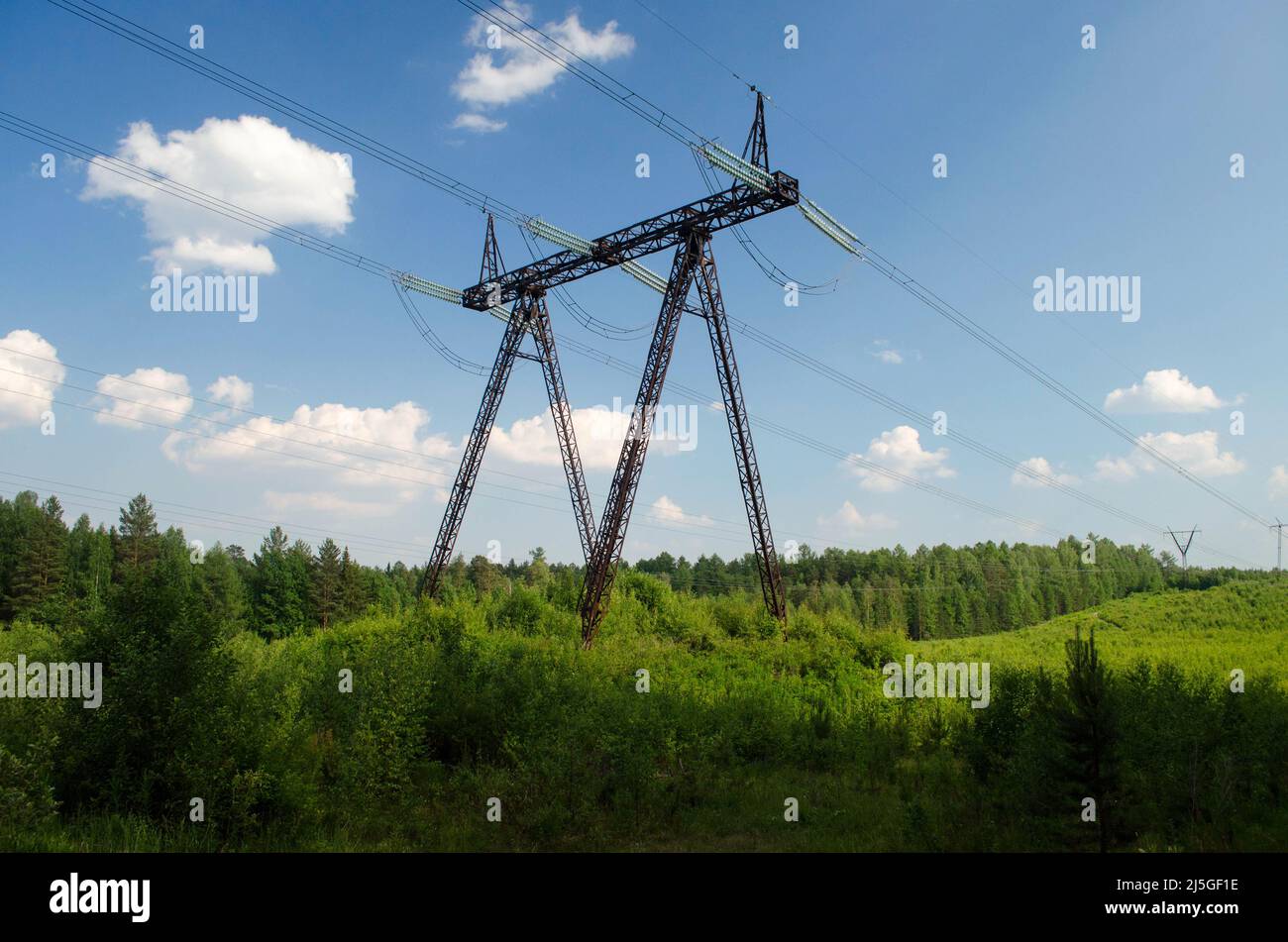 power lines on the slopes of the mountains against the background of ...