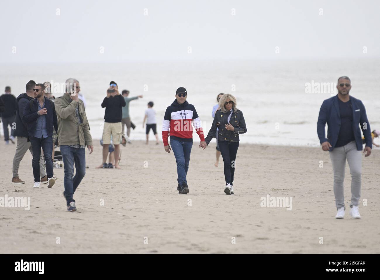 French President Emmanuel Macron and wife Brigitte Macron walking on ...