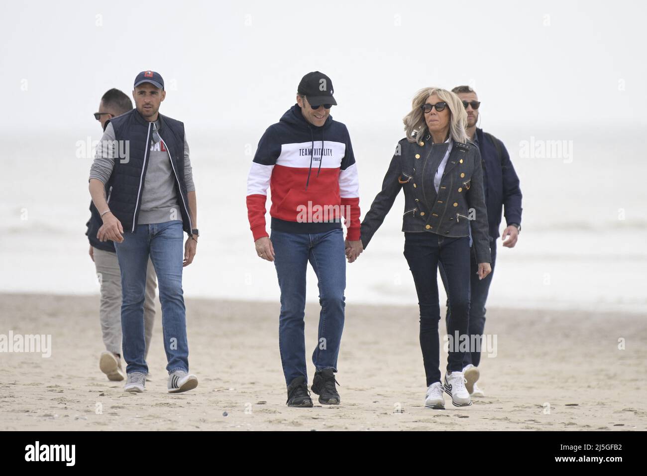 French President Emmanuel Macron and wife Brigitte Macron walking on ...