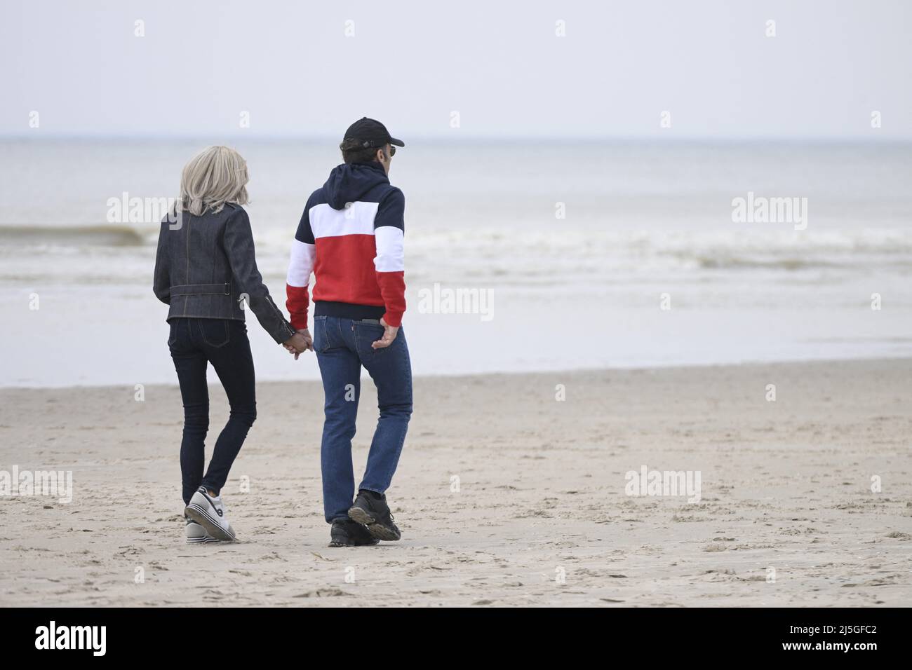 French President Emmanuel Macron and wife Brigitte Macron walking on ...