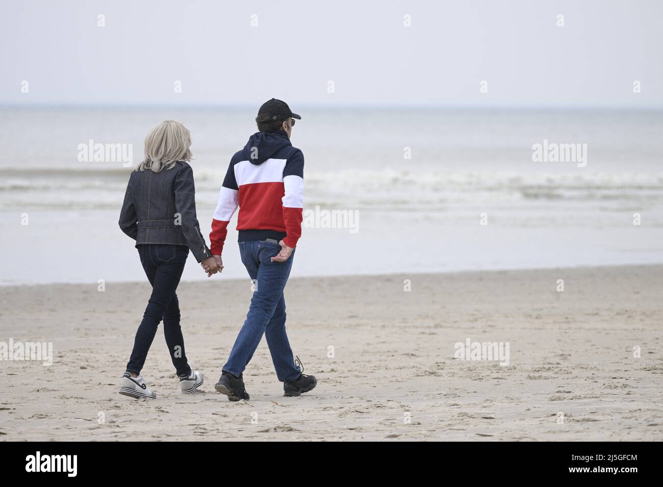 French President Emmanuel Macron and wife Brigitte Macron walking on ...