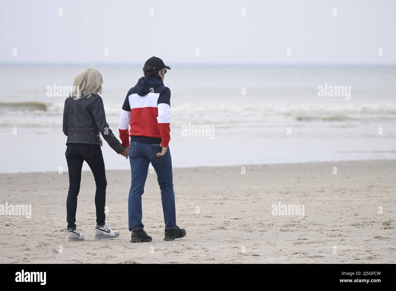 French President Emmanuel Macron and wife Brigitte Macron walking on ...