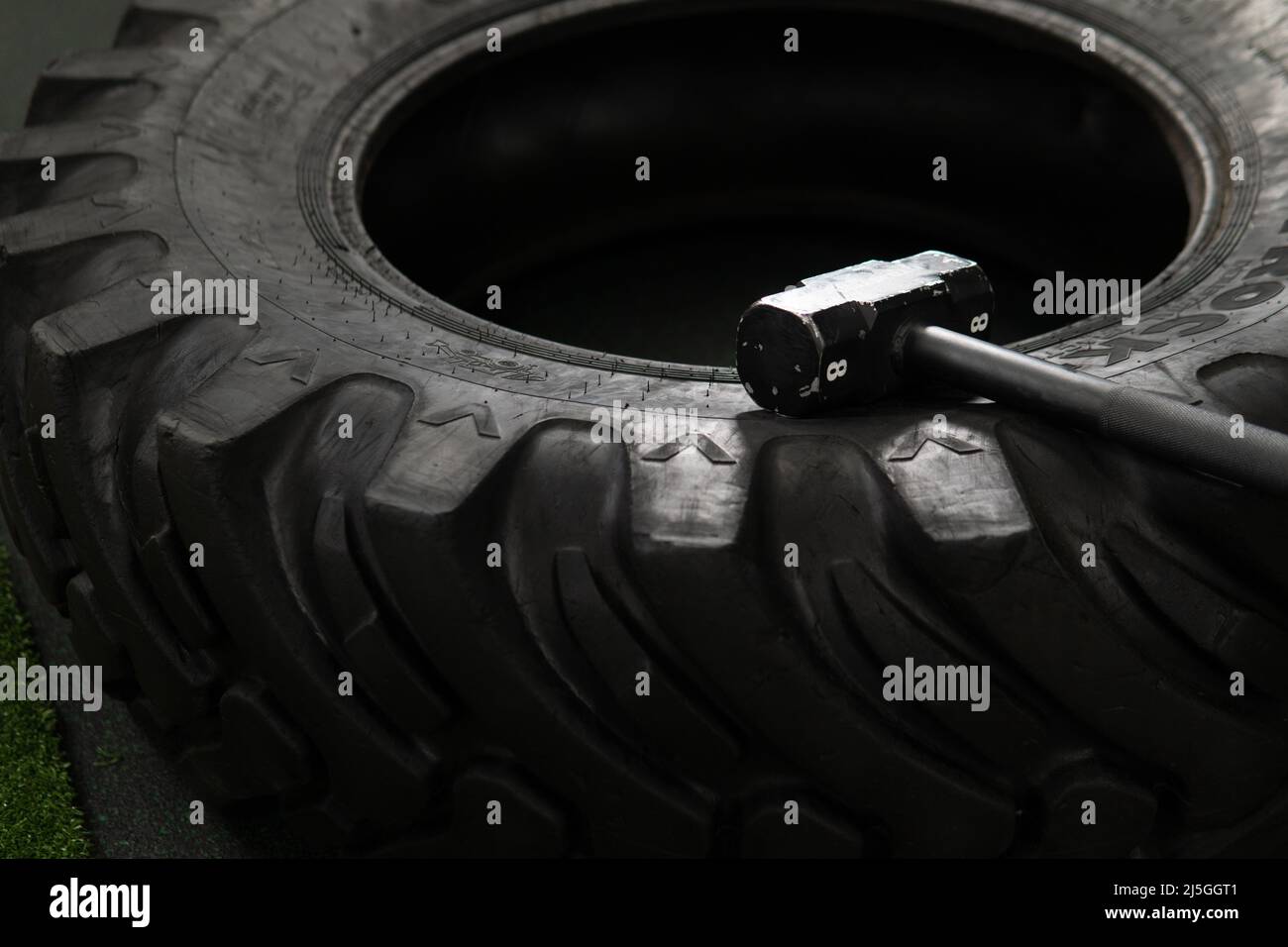 Black wheel tire sledgehammer crossfit workout athlete bodybuilding ...