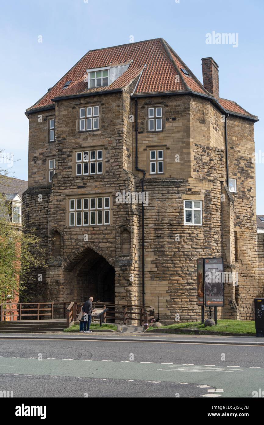 Two people read an information board outside The Black Gate of ...