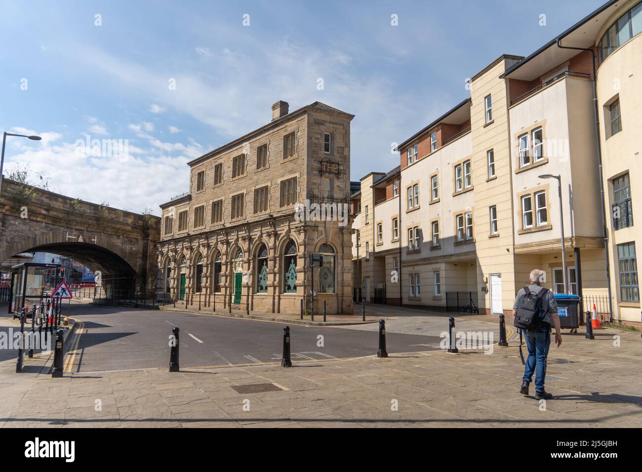 A man walks past The Central bar, an interesting coffin shaped building ...