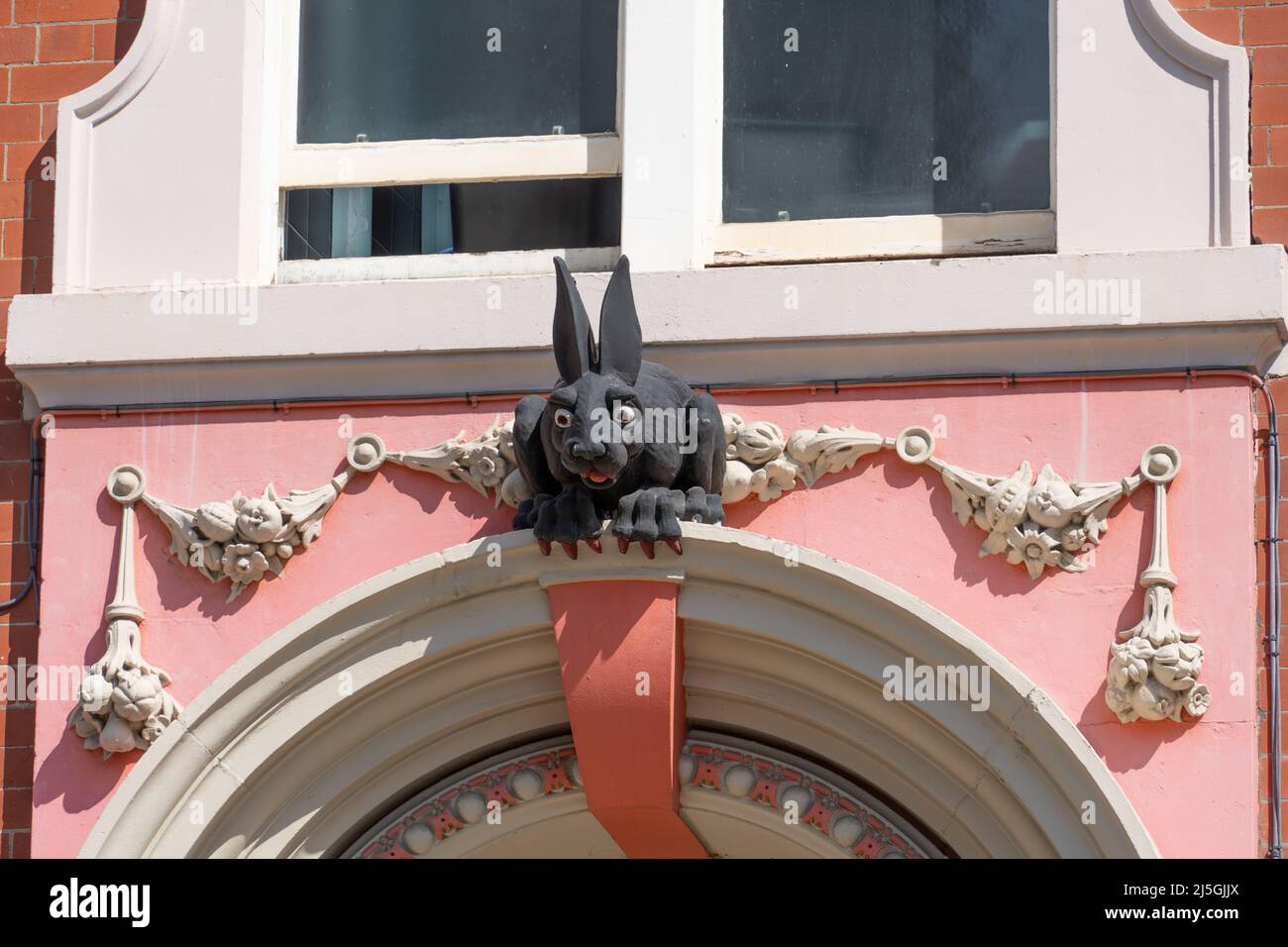 Close up of quirky landmark “The Vampire Rabbit” on a building ...