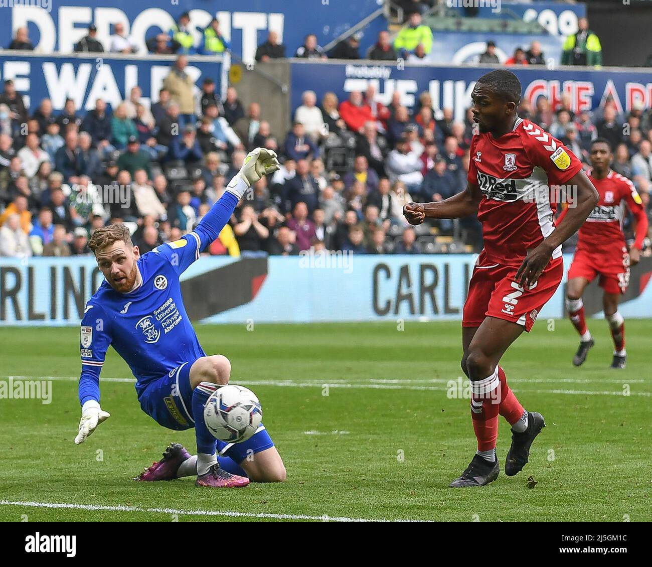 Andy Fisher #33 of Swansea City saves from Anfernee Dijksteel #2 of ...