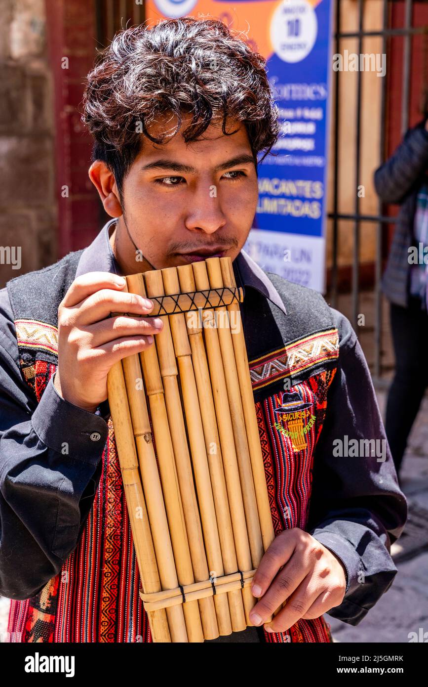 Musicians Parade Through The Streets Playing Pan Pipes During A ...