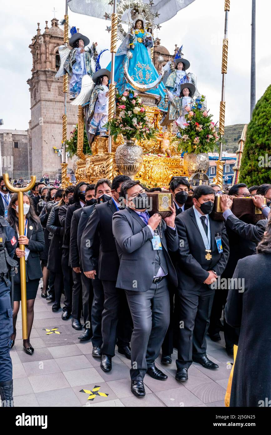 A Statue Of The Virgin Mary Is Carried Through The Streets Of Puno ...